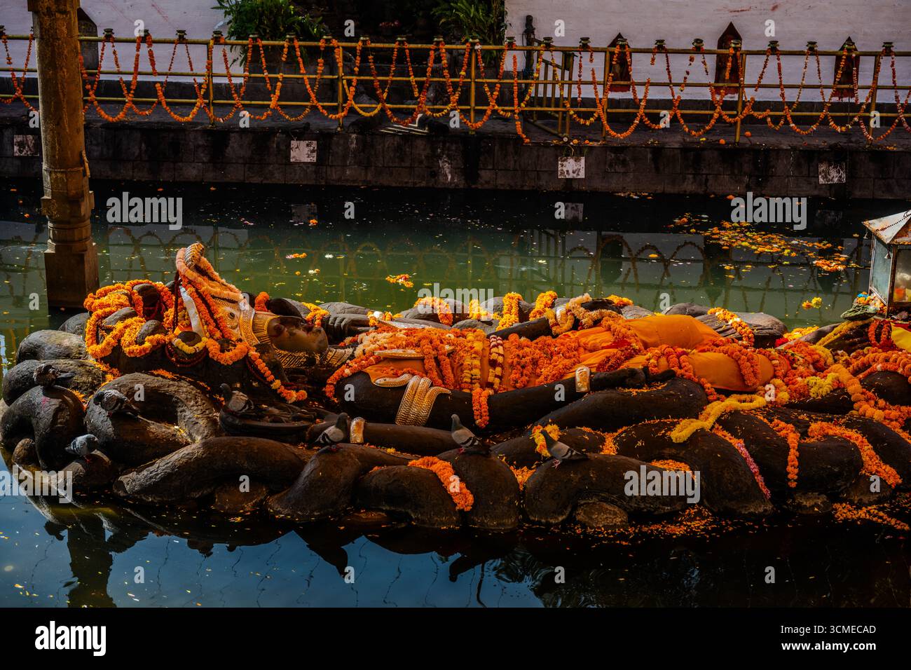 The sacred Budhanilkantha Temple in Kathmandu, Nepal, features a large ...