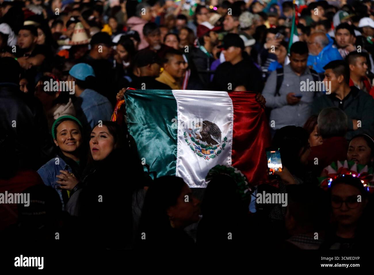 People attend the Grito de Independencia for the 215th anniversary of ...