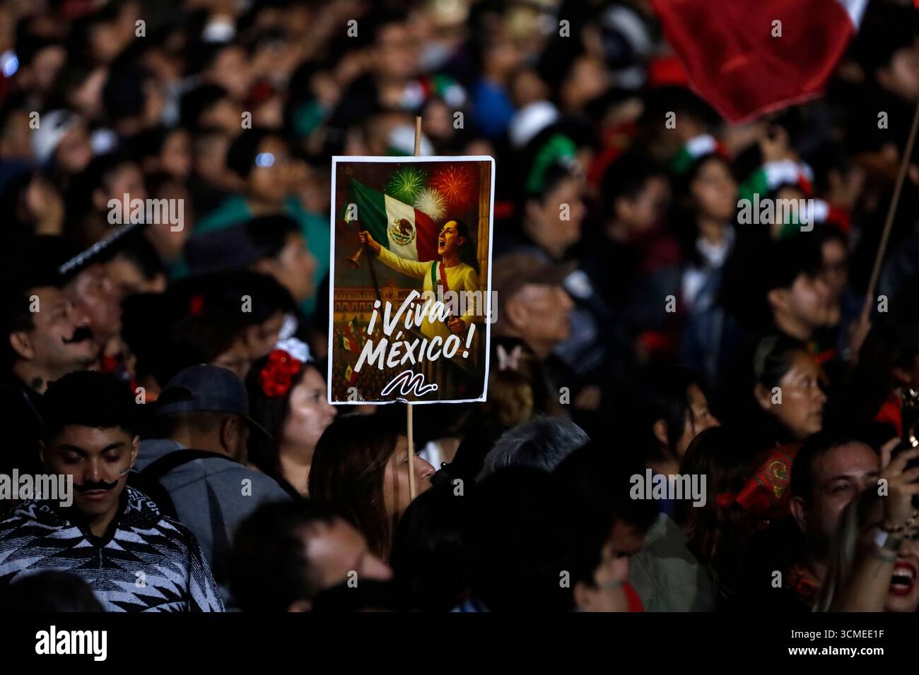 People attend the Grito de Independencia for the 215th anniversary of ...