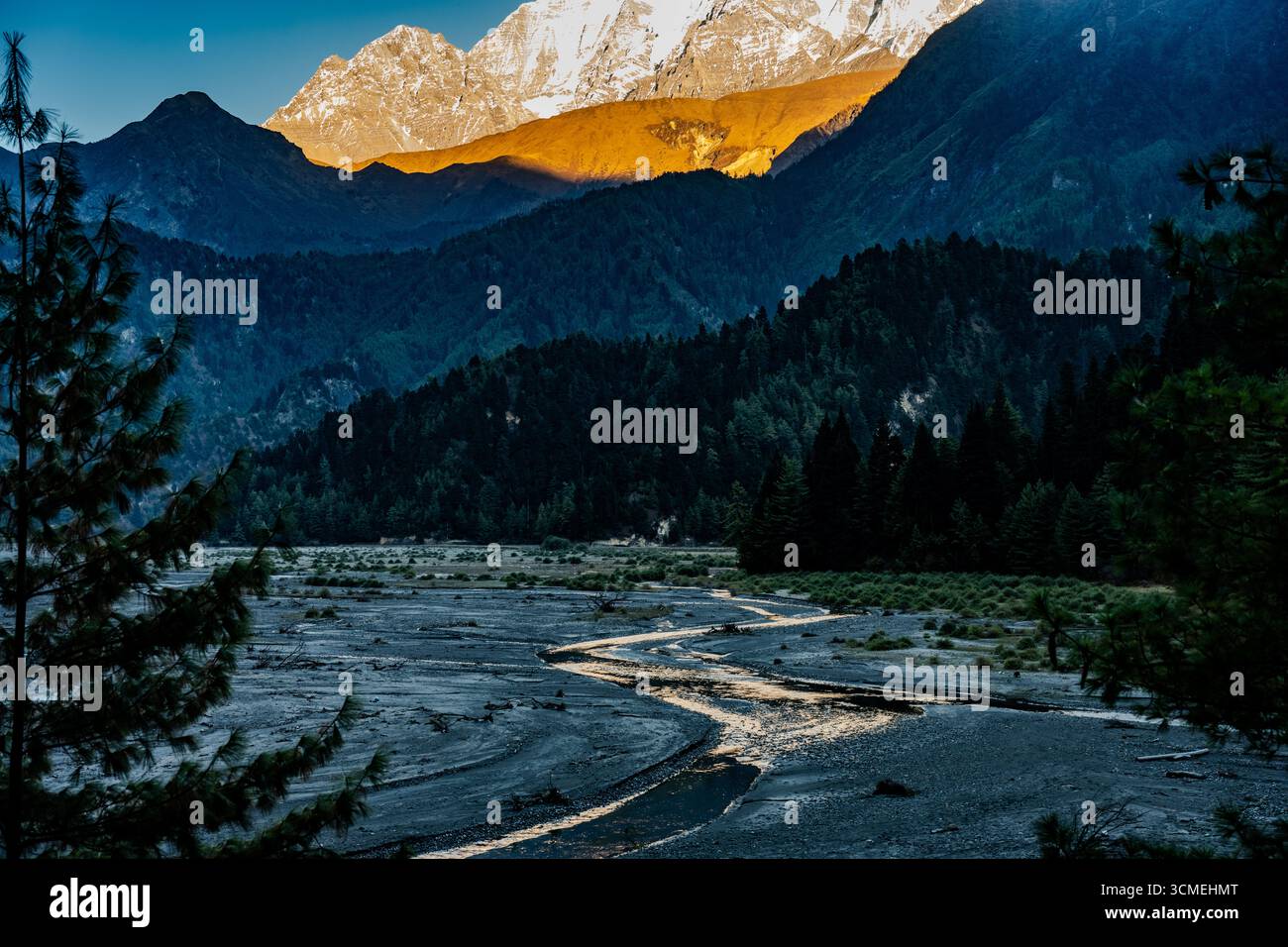 Serene Mountain River at Dusk with Golden Light on Himalayan Peaks in ...