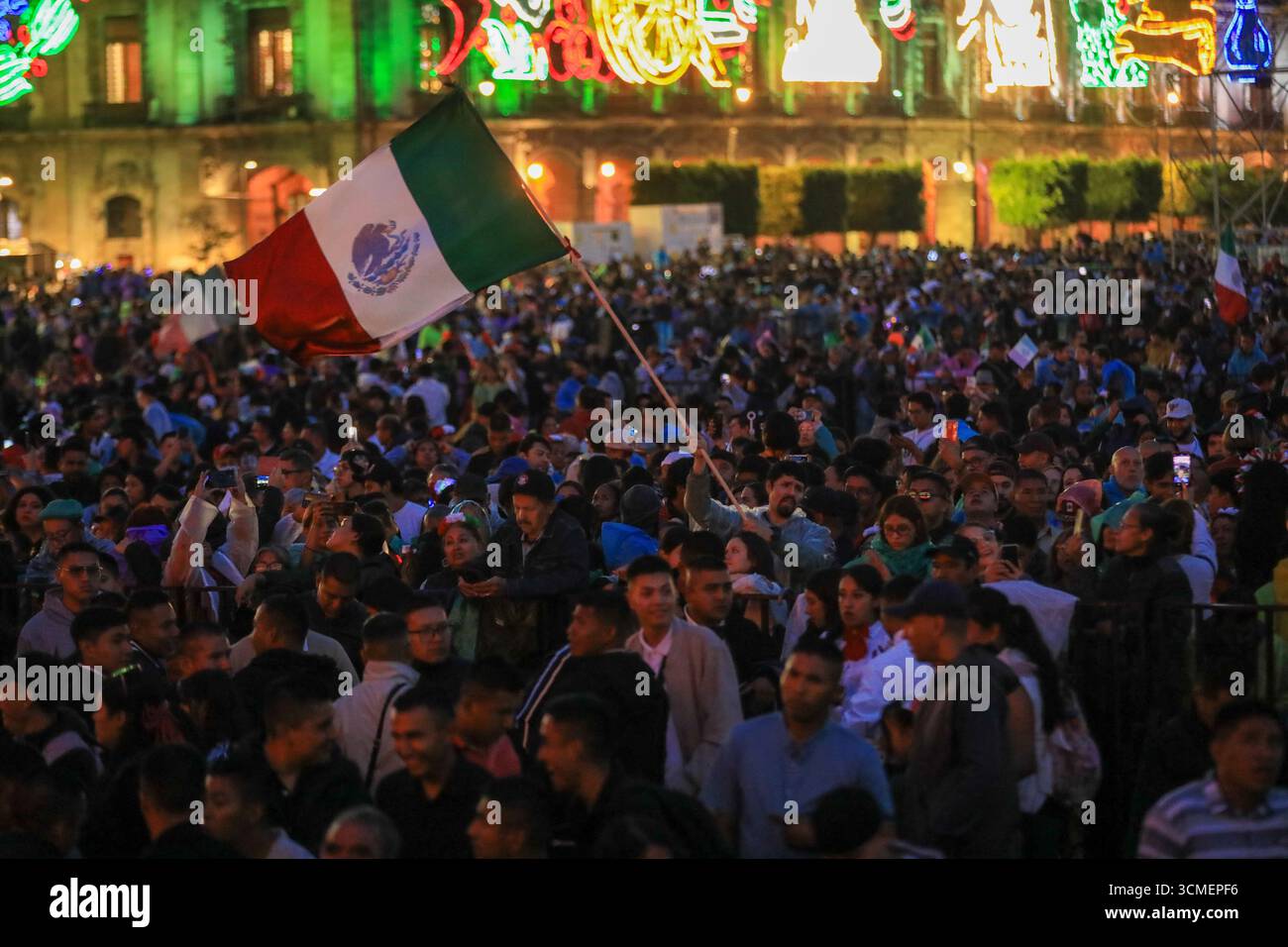 People attend the Grito de Independencia for the 215th anniversary of ...