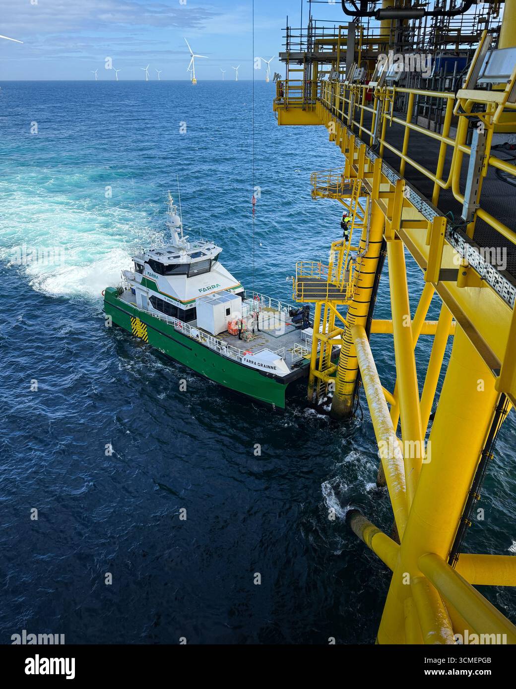 Crew transfer vessel alongside offshore wind substation in the North ...