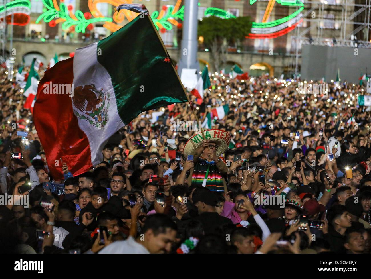 People attend the Grito de Independencia for the 215th anniversary of ...