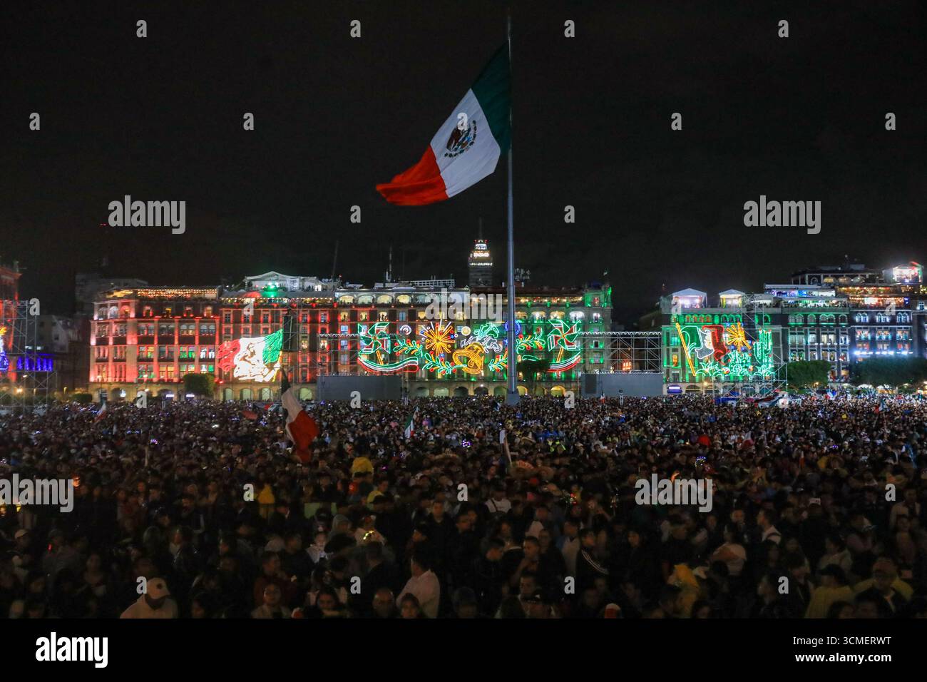 People attend the Grito de Independencia for the 215th anniversary of ...
