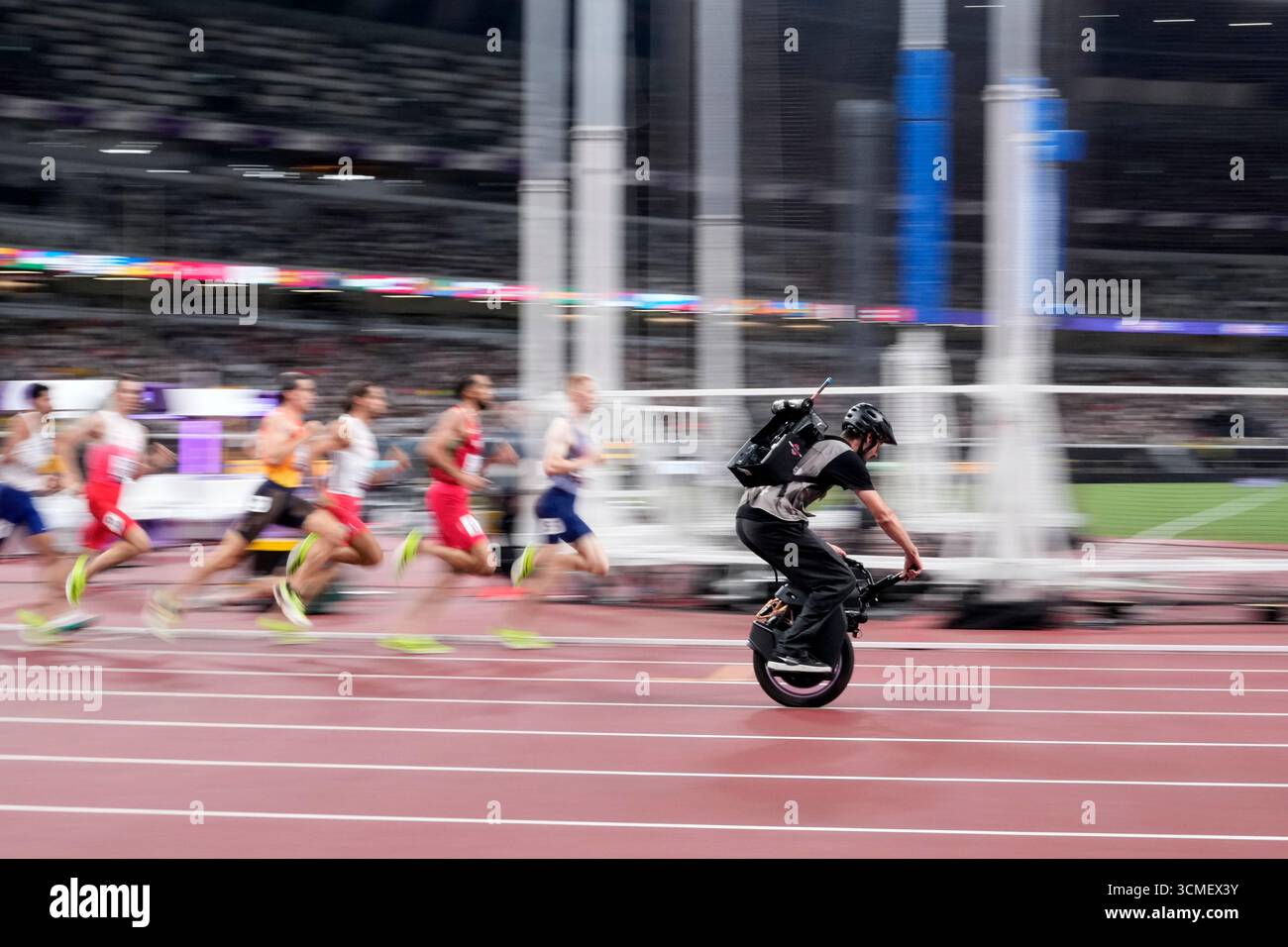 A cameraman on a monowheel covers the men's 800 meters heats at the ...