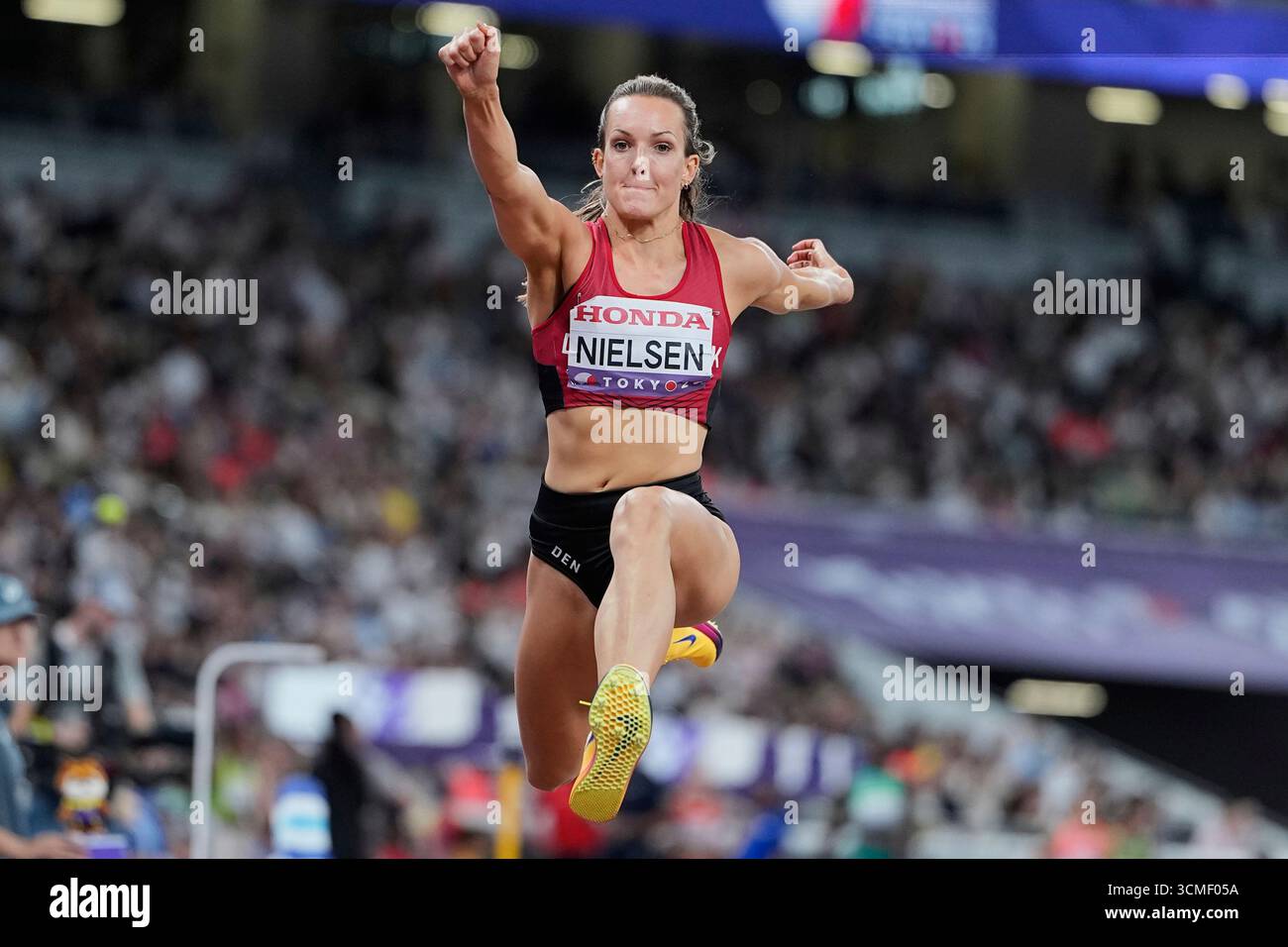 Denmark's Janne Nielsen competes in the women's triple jump ...