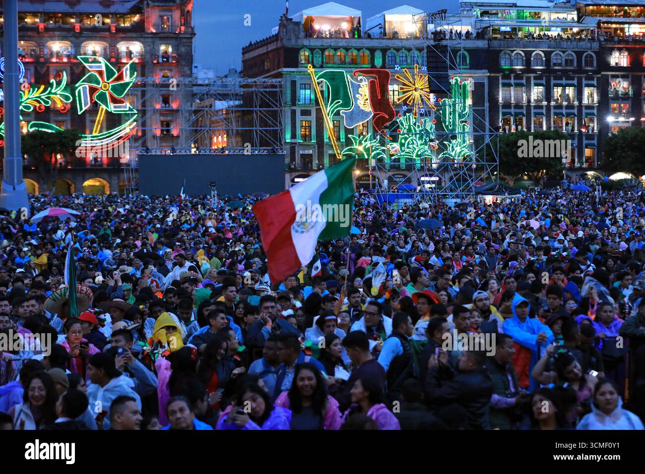 People attend the Grito de Independencia for the 215th anniversary of ...