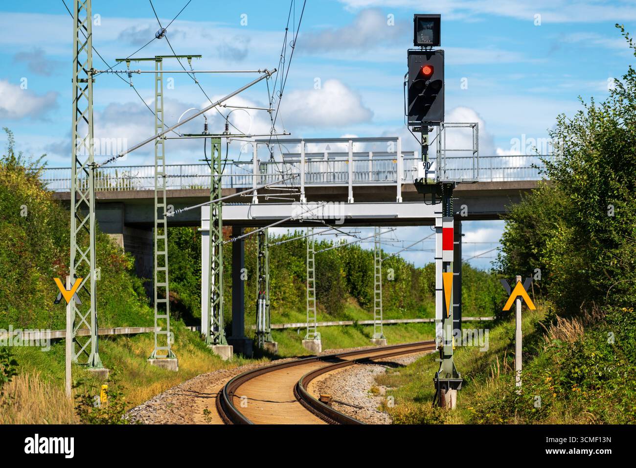 Bavaria, Germany - September 15, 2025: A railroad signal turns red and ...