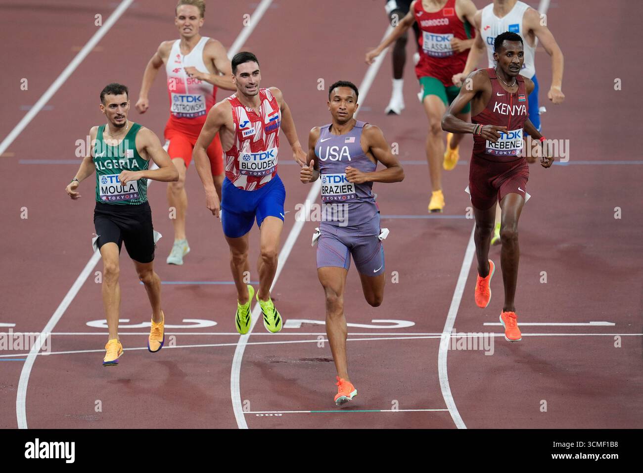 United States' Donavan Brazier center, crosses the finish line in the ...