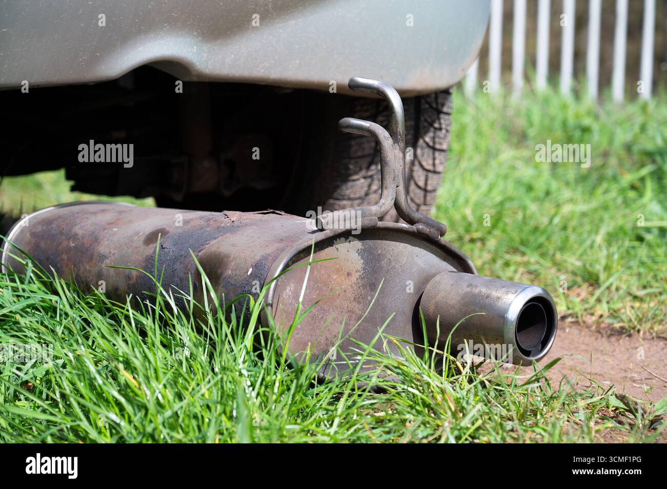 Broken Exhaust And Muffler Of A Car, Rusted Silencer Fallen Down On The ...