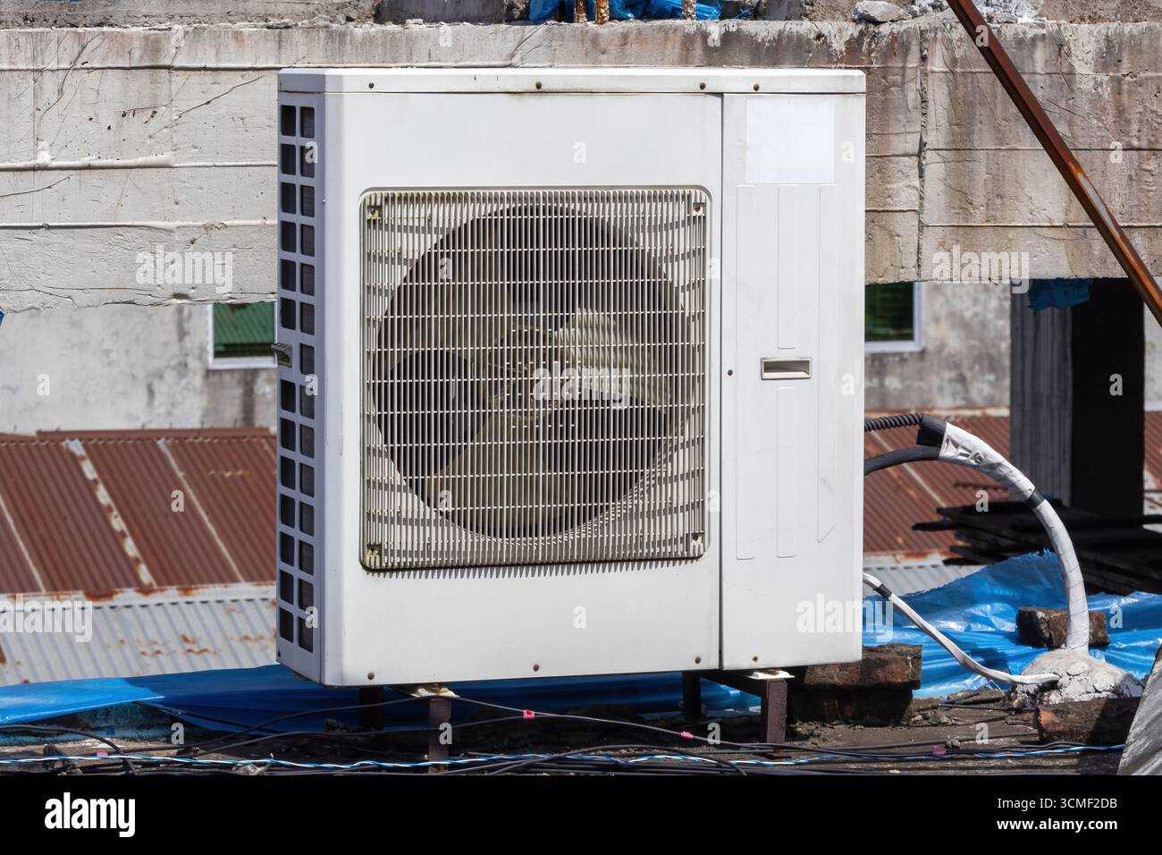 Close-up of an outdoor air conditioning compressor unit, a vital part ...
