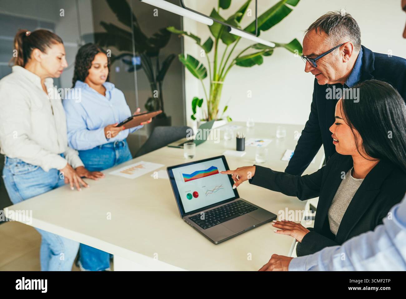 Multigenerational team discussing business hi-res stock photography and images - Alamy