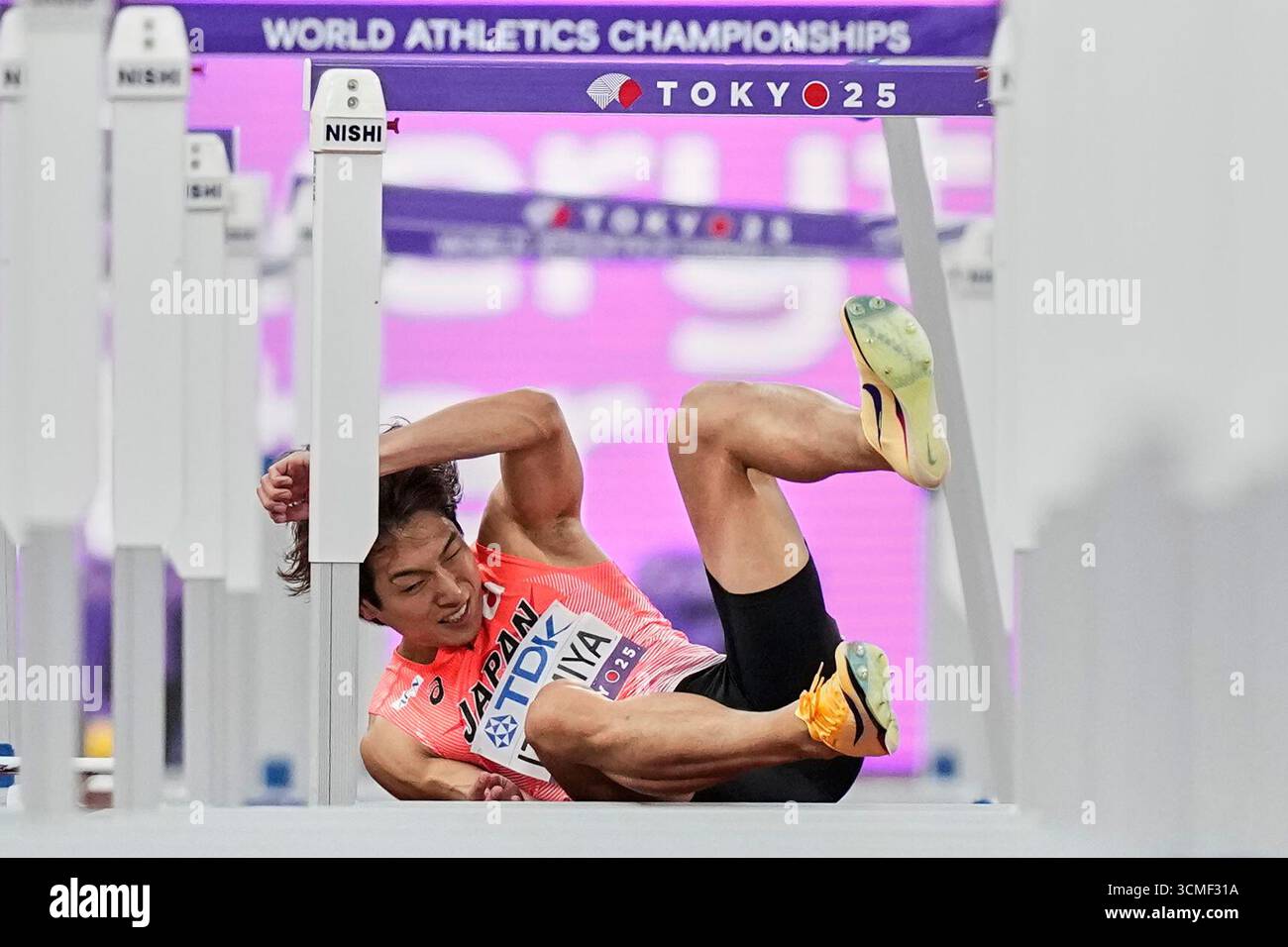 Japan's Shunsuke Izumiya crashes in a men's 110 meters hurdles ...