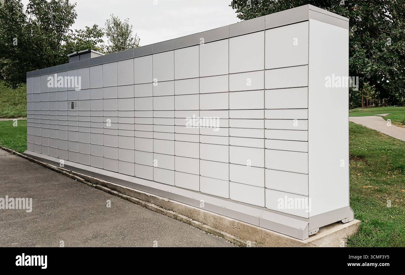 Modern outdoor parcel locker station with multiple compartments for ...