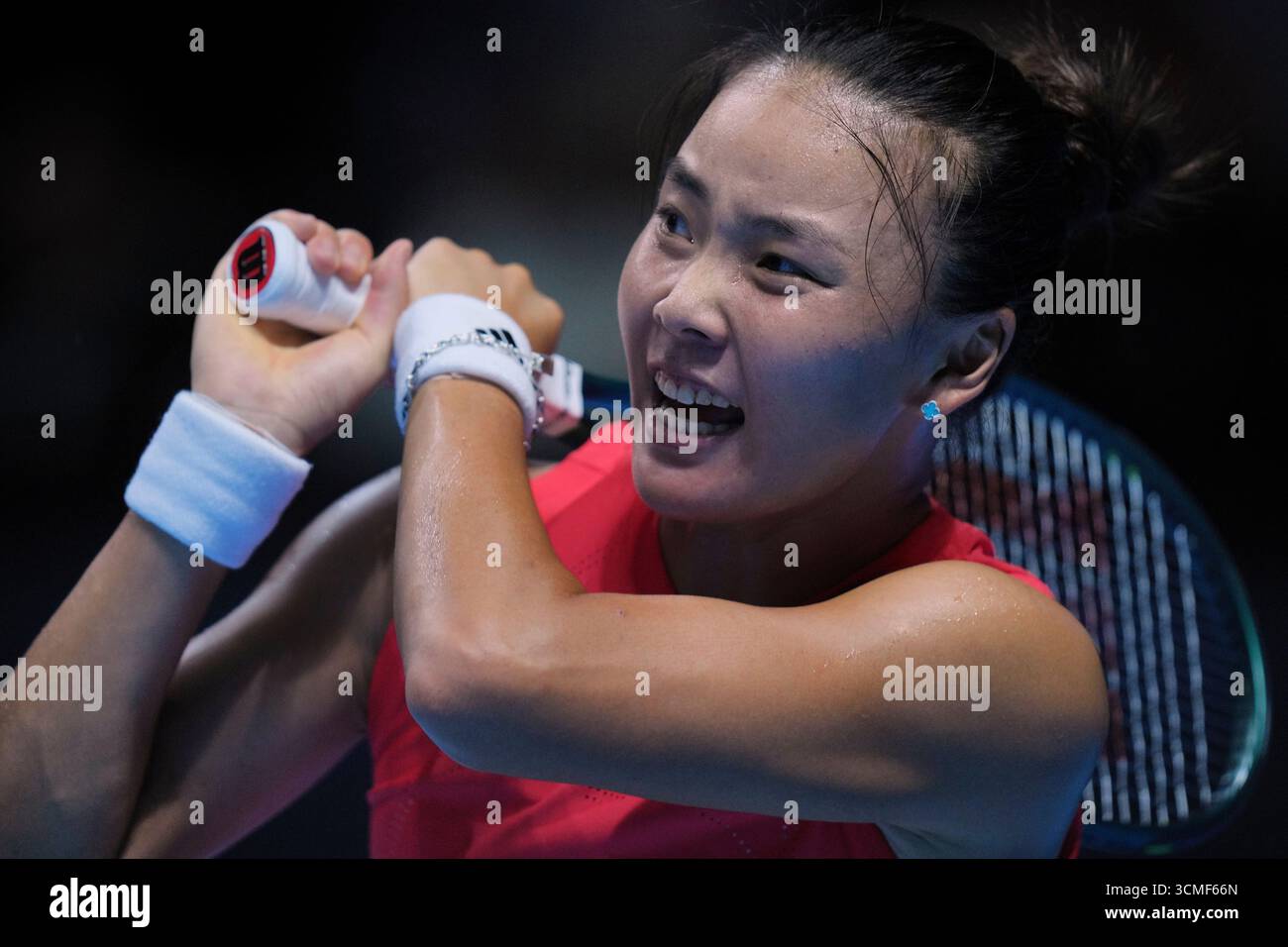 Yuan Yue, of Team China watches her shot as she plays against ...