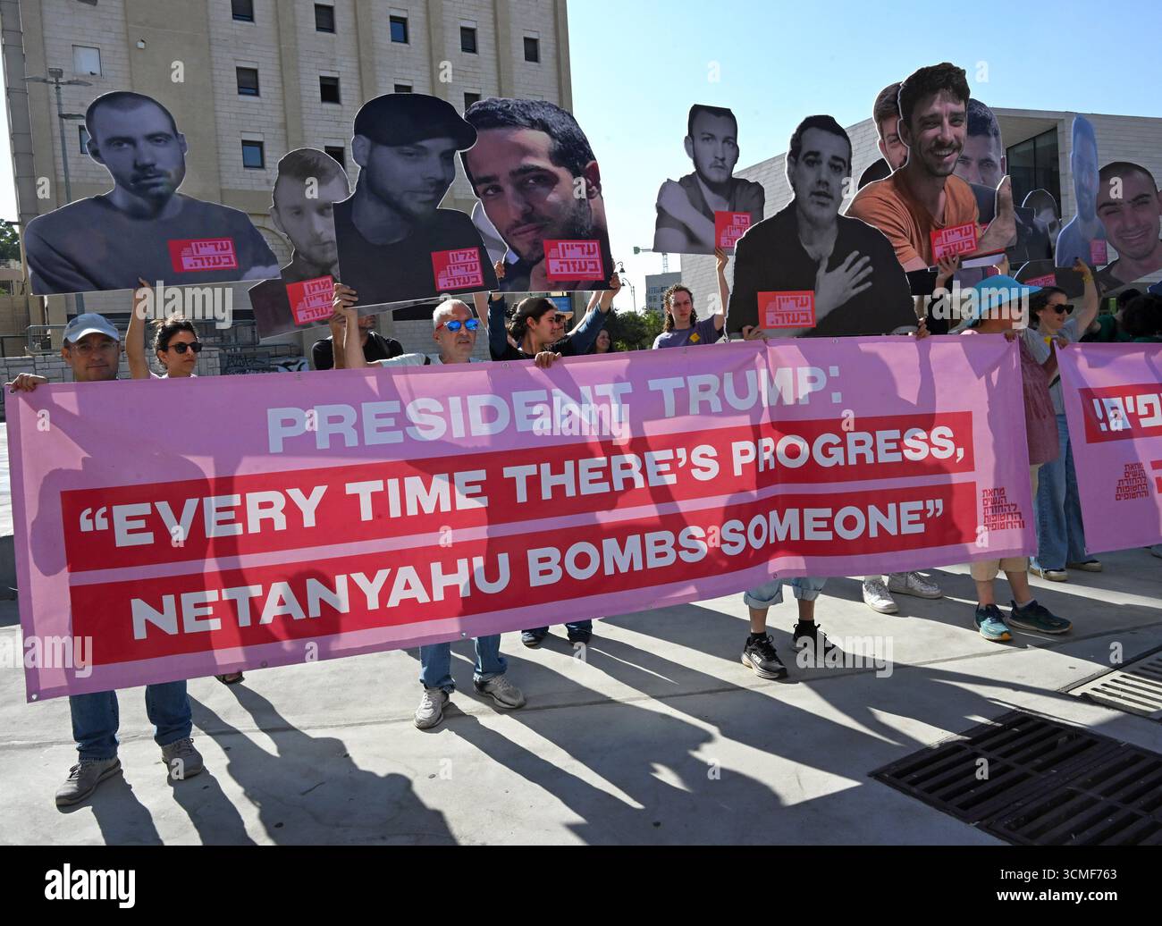 Jerusalem, Israel. 16th Sep, 2025. People hold banners and cut outs of ...