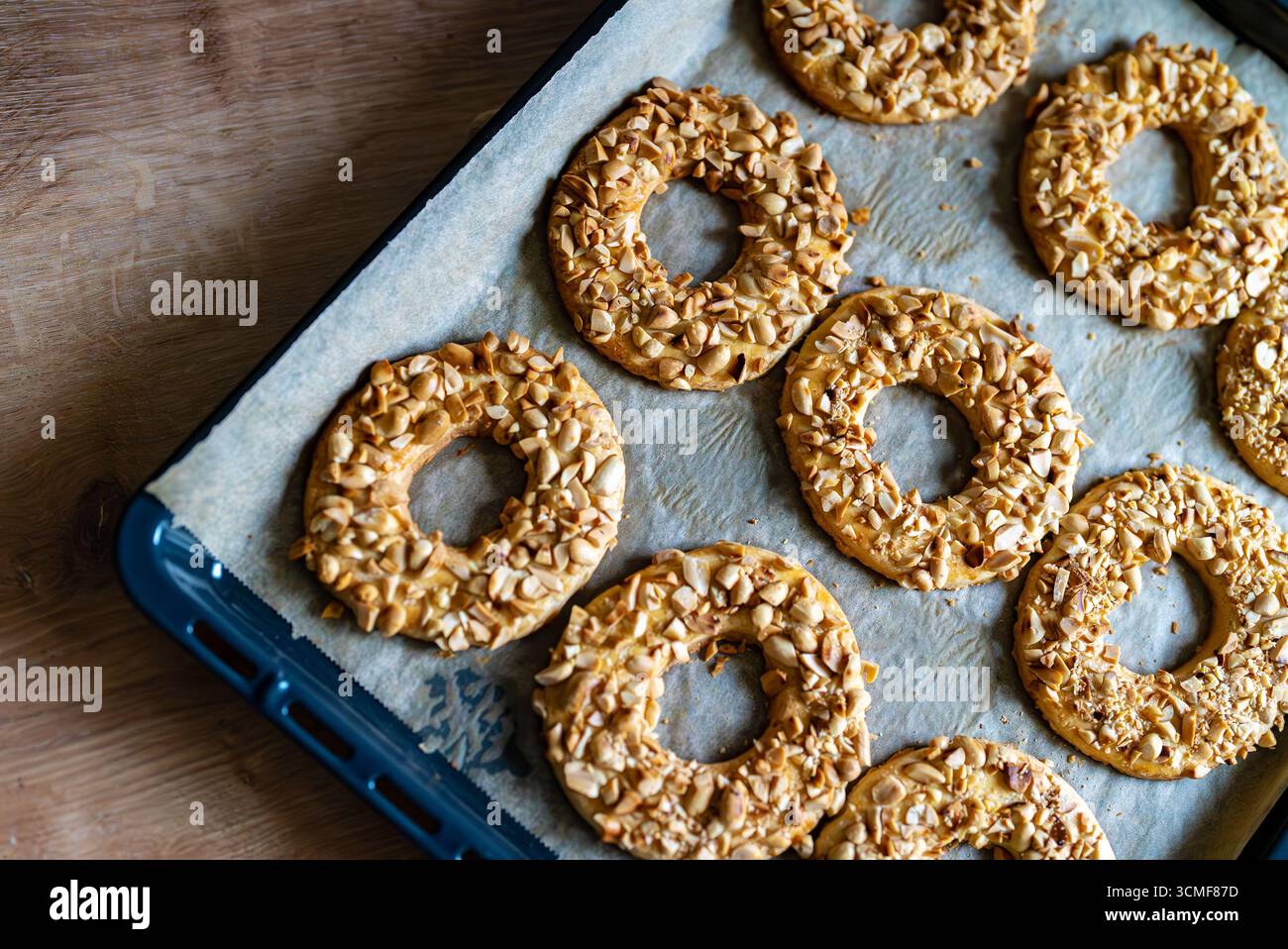 Baked peanut sand rings on a baking tray Stock Photo - Alamy