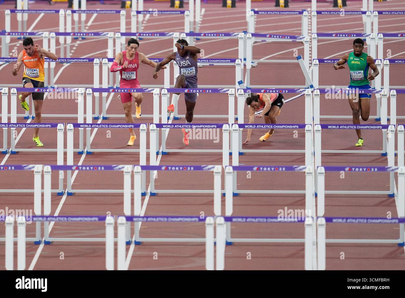 Japan's Shunsuke Izumiya, second from right, falls as China's Liu Junxi ...