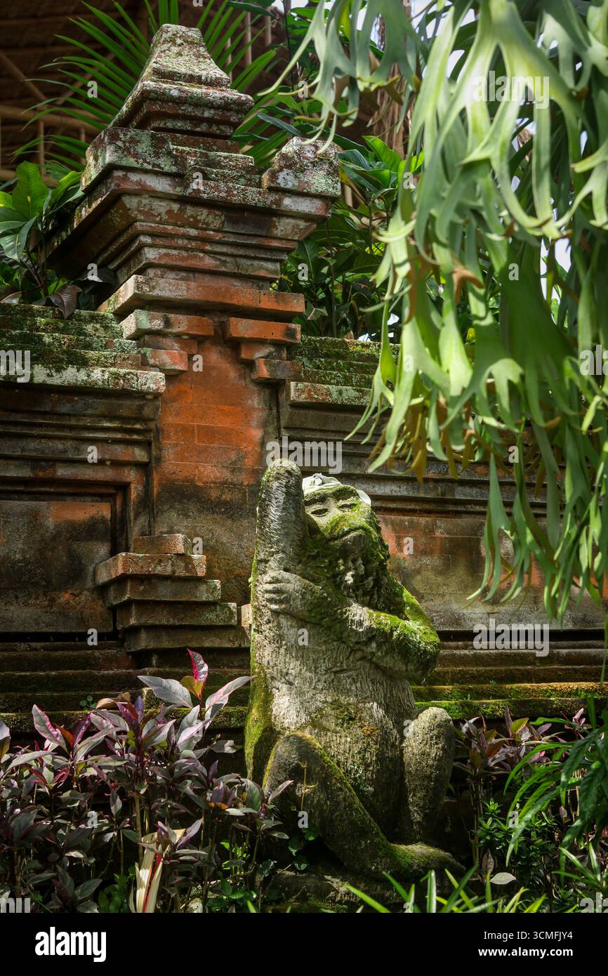 Ubud, Bali, Indonesia - May 11, 2025: Stone monkey statue in front of ...