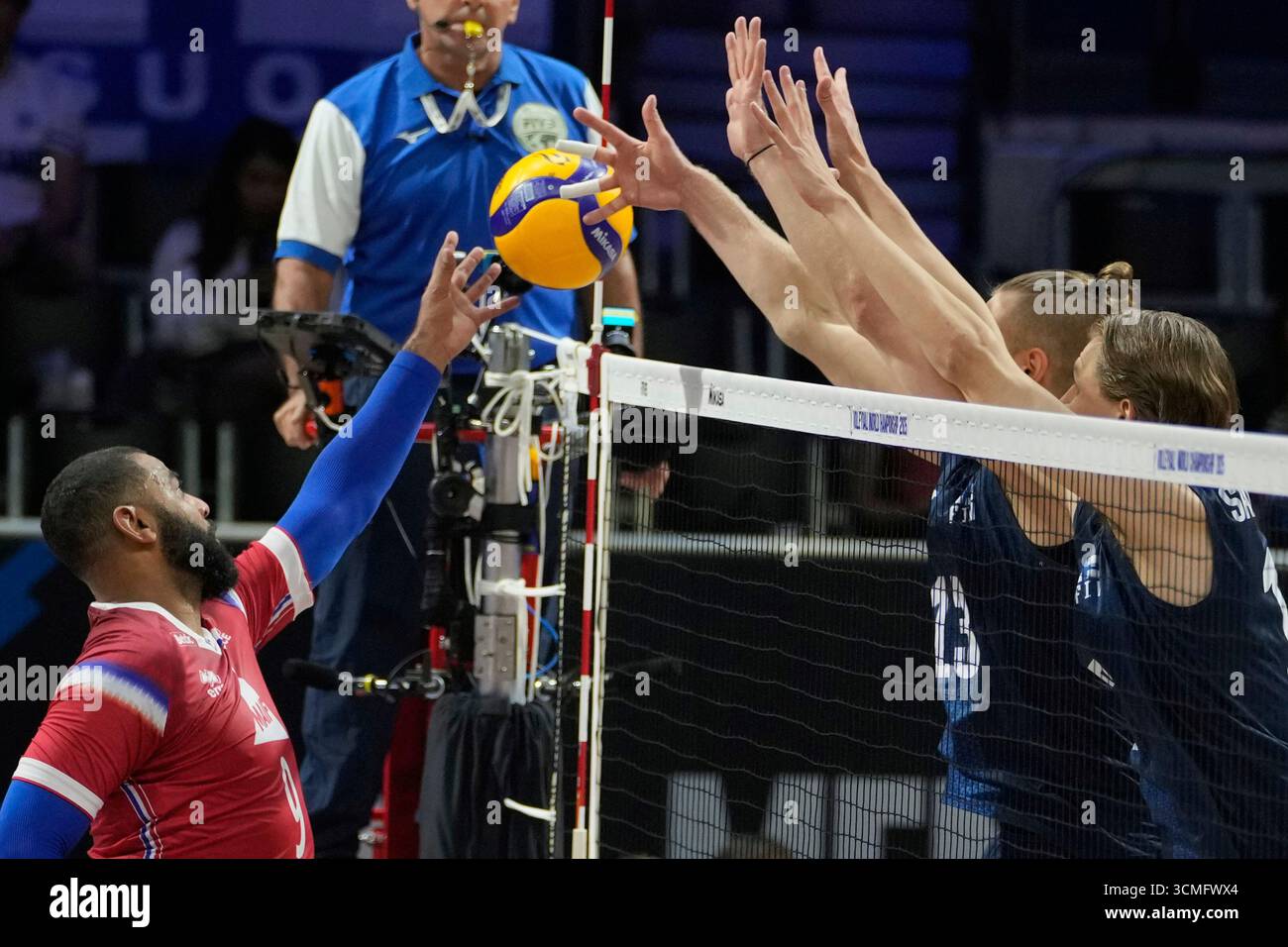 Earvin Ngapeth of France hits the ball against Finland during their ...