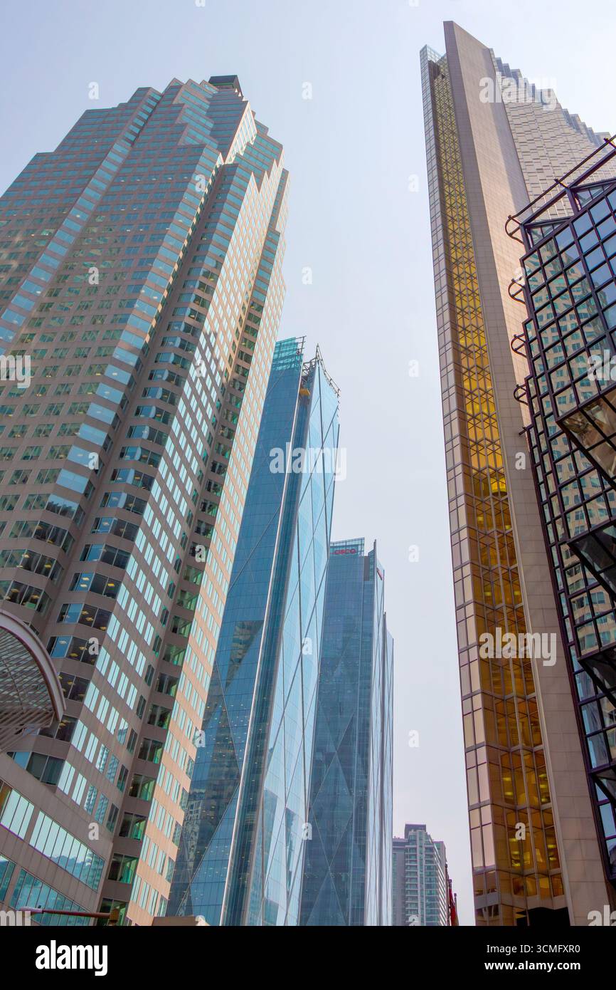 Looking upwards to the skyscrapers towering like giants pointing to the ...
