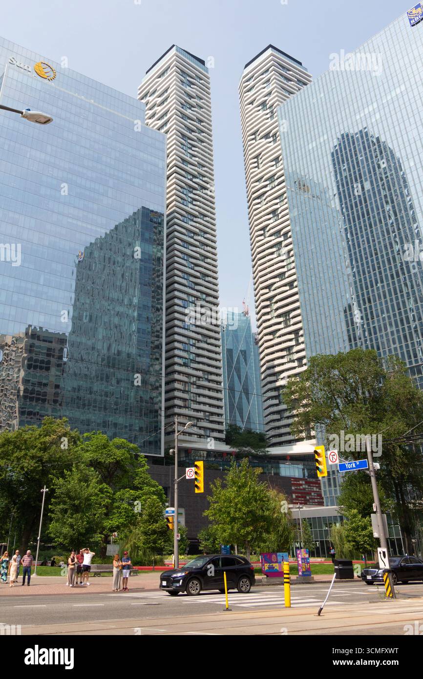 Downtown Toronto street scene of skyscrapers towering like giants over ...