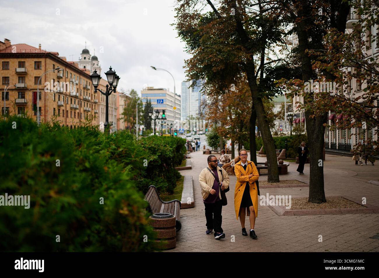 People walk along Lenin street in Minsk, Belarus, Tuesday, Sept. 16 ...