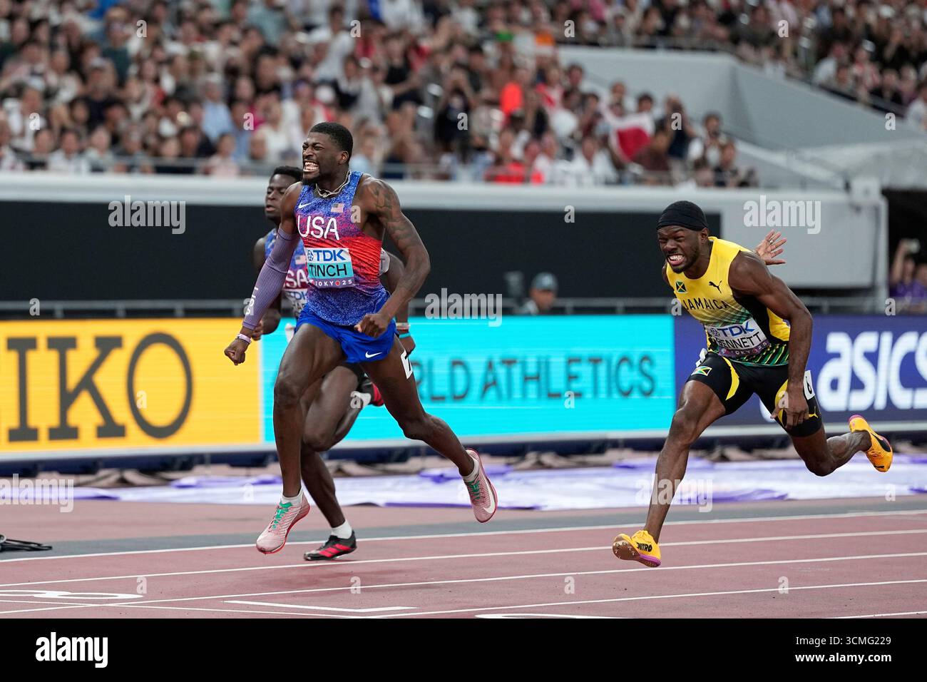 United States' Cordell Tinch crosses the finish line ahead of Jamaica's ...