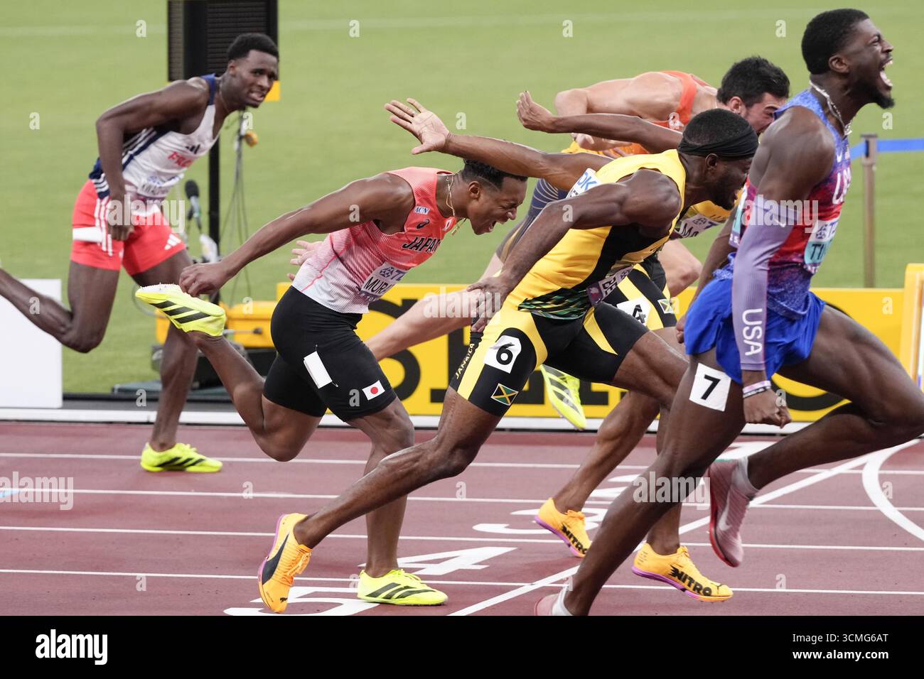 Athletes cross the finish line in the men's 110-meter hurdles final at ...
