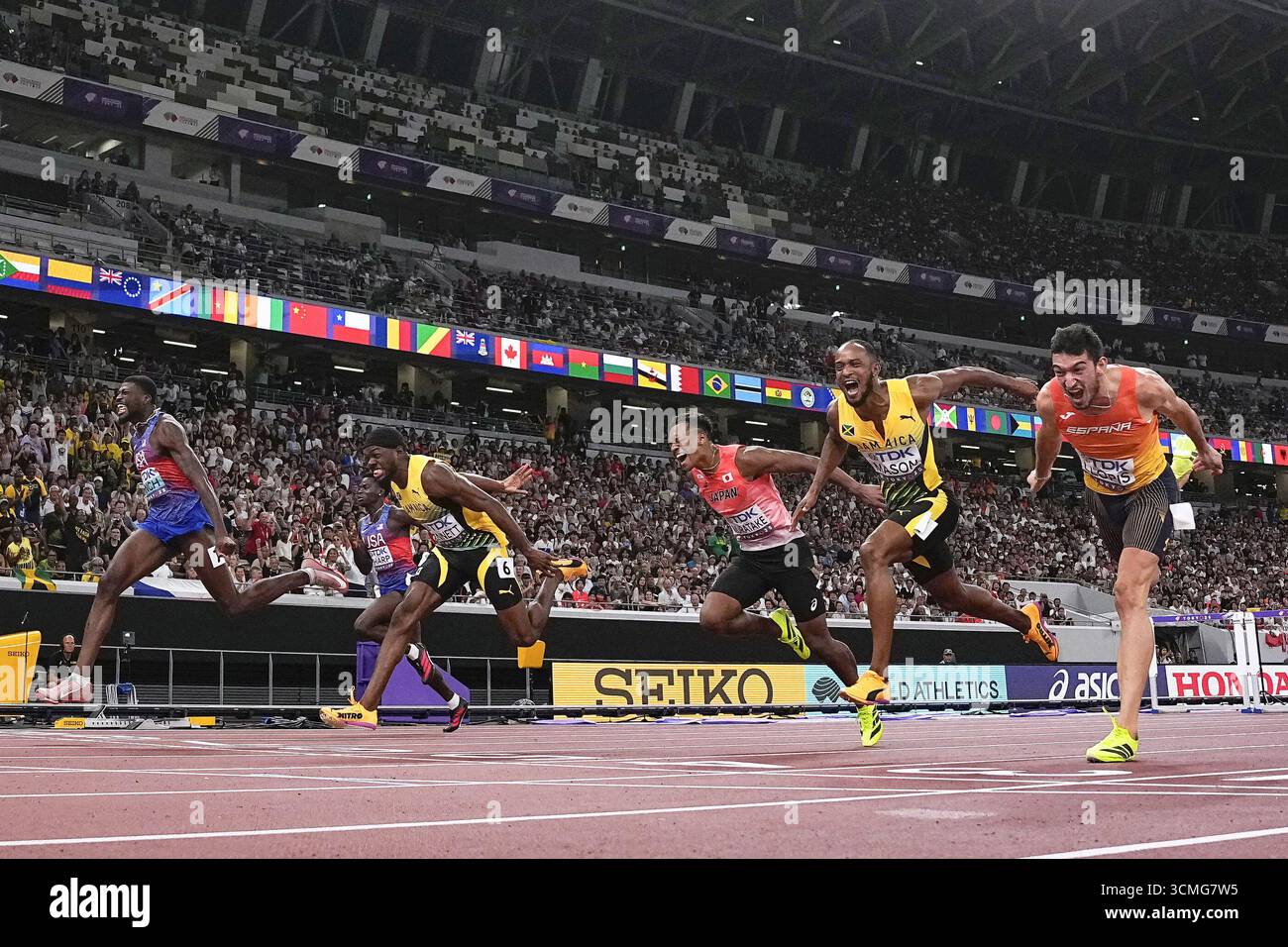 Athletes cross the finish line in the men's 110-meter hurdles final at ...