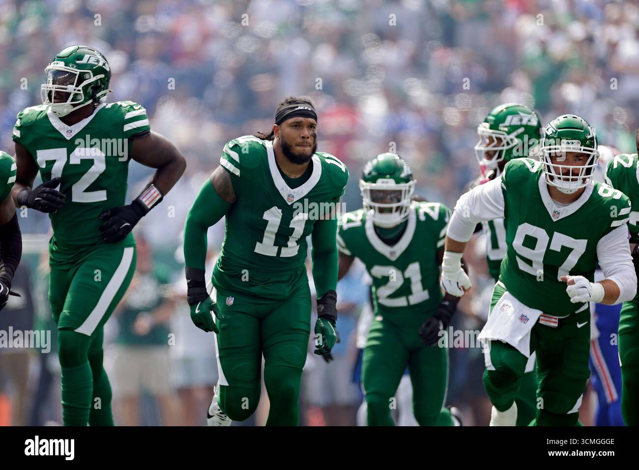 New York Jets linebacker Jermaine Johnson (11) with teammates before an ...