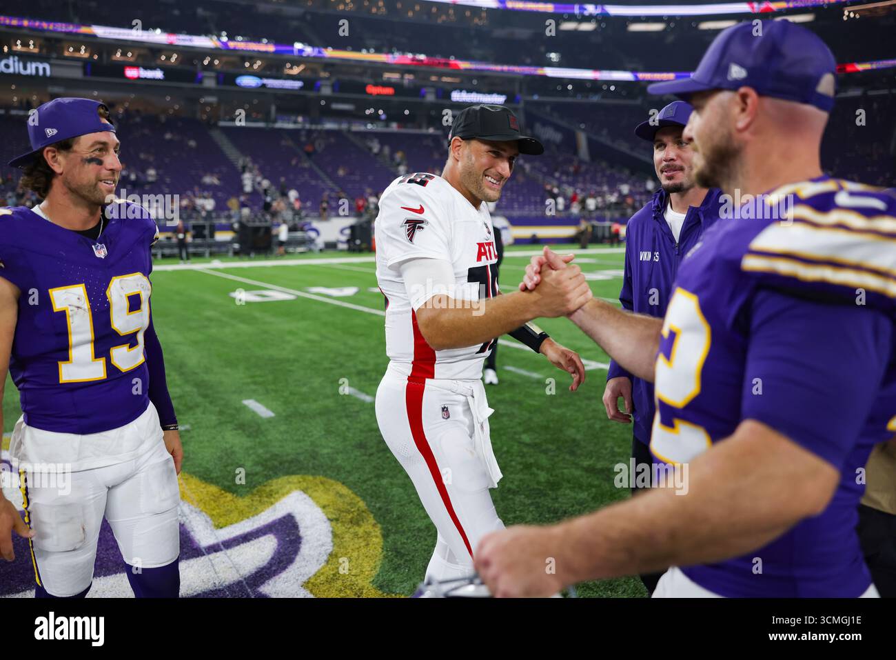 Atlanta Falcons quarterback Kirk Cousins (18) greets Minnesota Vikings ...