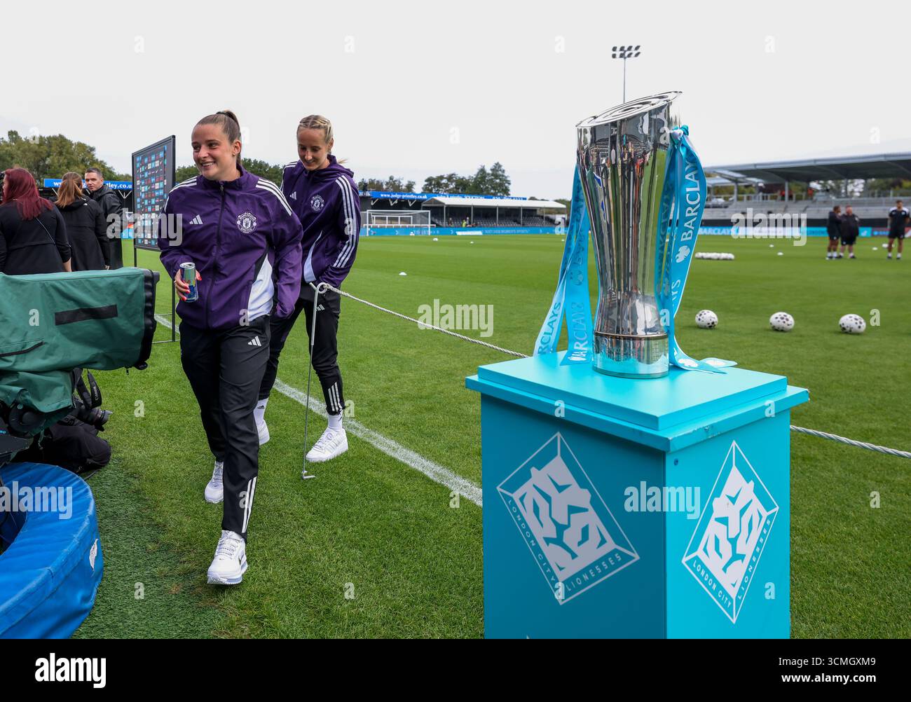 Manchester United's Ella Toone walks past the WSL trophy ahead of the ...