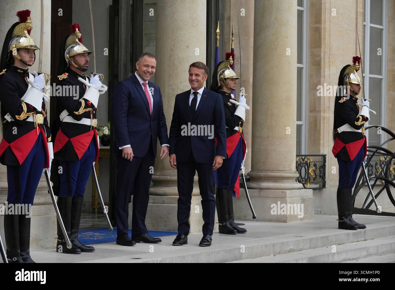 French President Emmanuel Macron, right, welcomes Poland's President ...