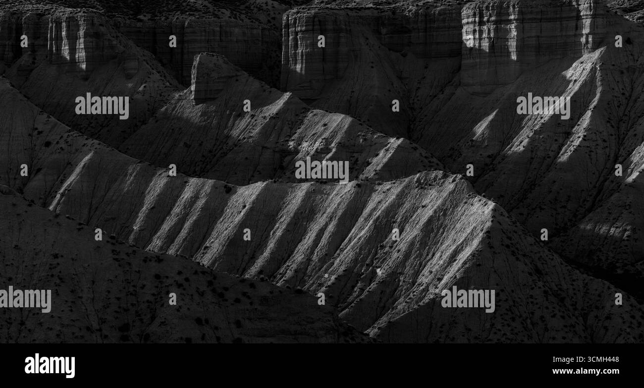 A landscape of ravines and badlands in the Gorafe Desert in the Granada ...