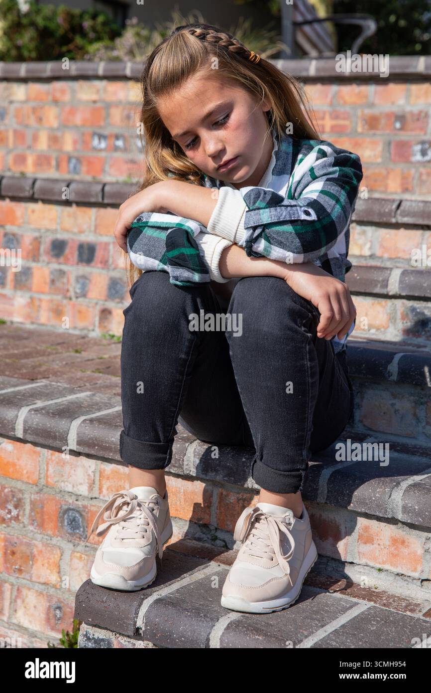 Child child sitting on steps hi-res stock photography and images - Alamy