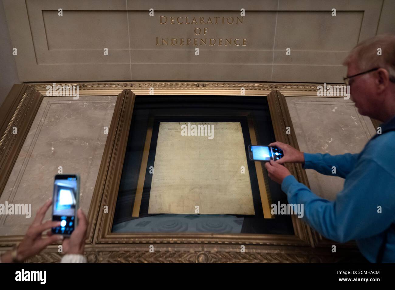 Visitors take photos of the Declaration of Independence as it is ...