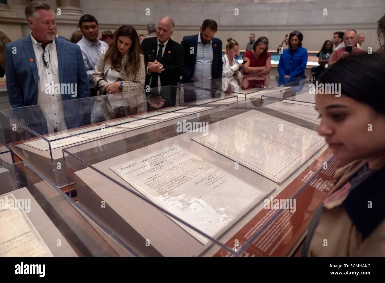 Visitors look at amendments to the U.S. Constitution as they are ...