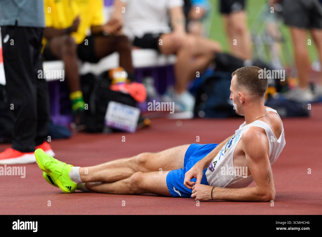 Jan Stefela (Czech Republic) lying on the round and watching his ...