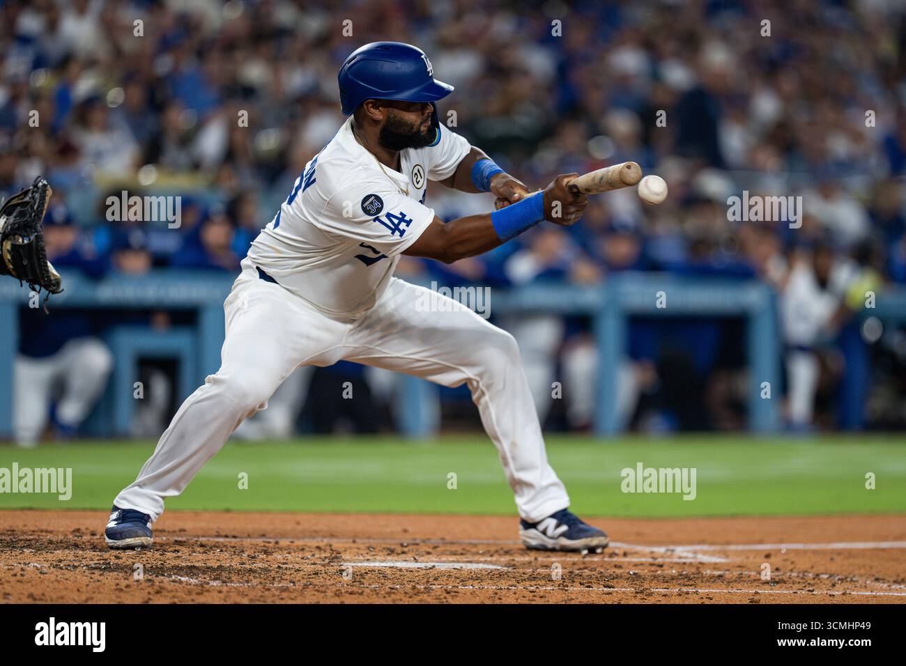 Los Angeles Dodgers catcher Chuckie Robinson (52) bunts during a MLB ...