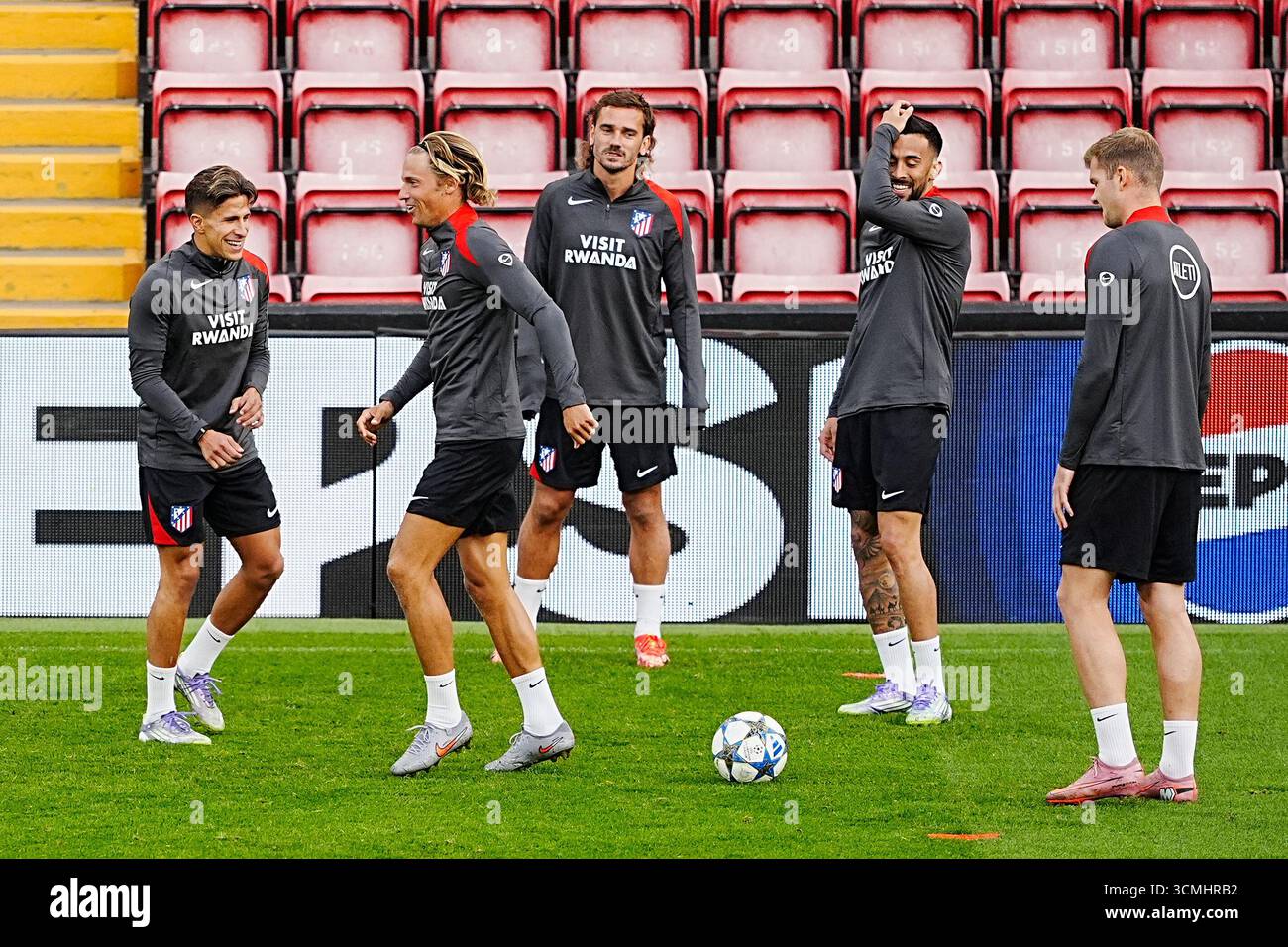 Atletico Madrid's Antoine Griezmann (centre) and team-mates during a ...