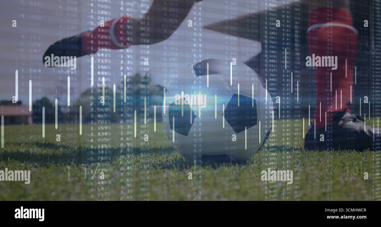 Soccer player's legs dribbling black-and-white ball on grass pitch ...