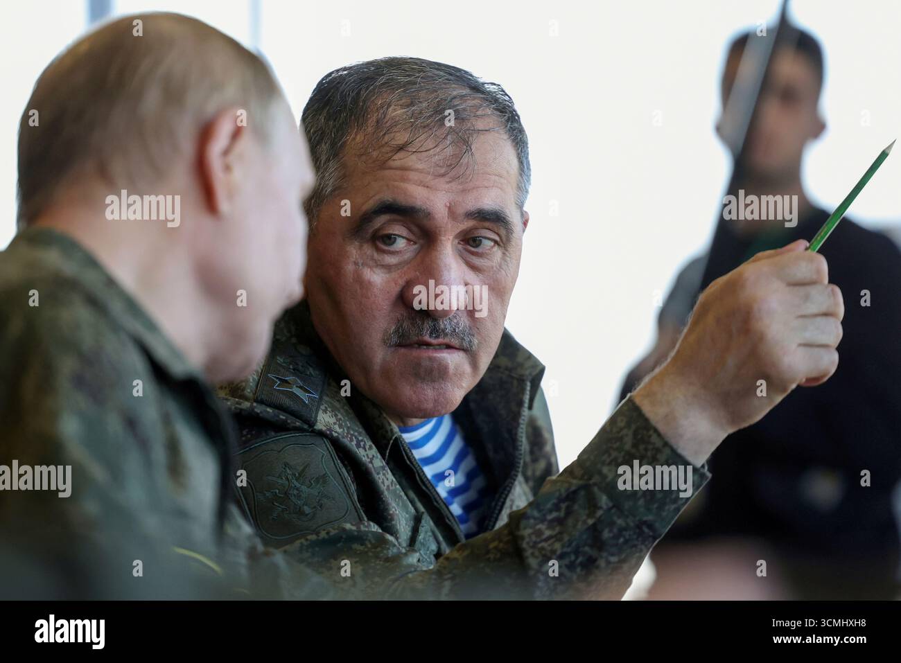 Russian President Vladimir Putin, left, speaks with Deputy Defence ...