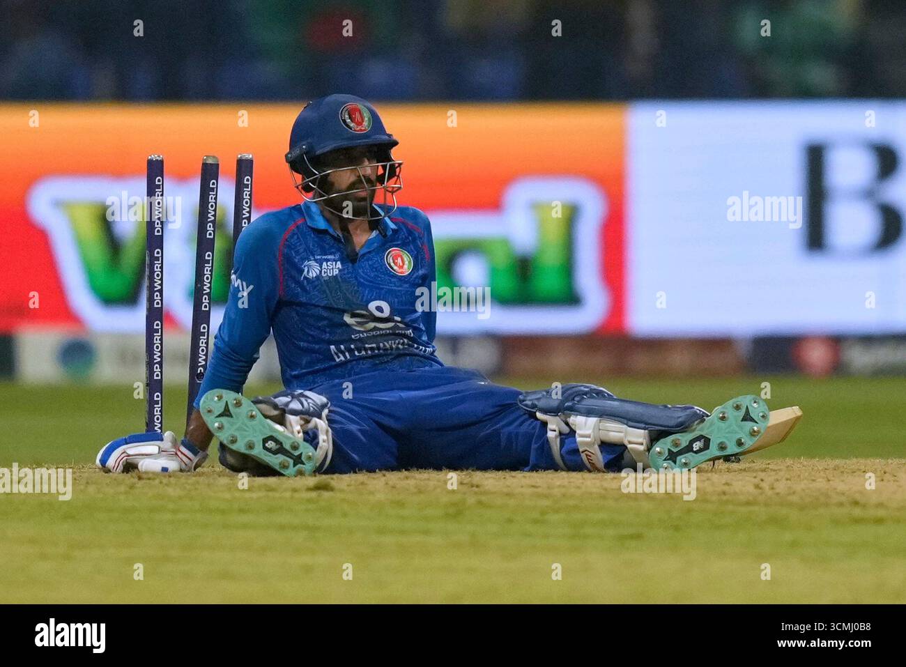Afghanistan's Karim Janat reacts after he was run out during the Asia ...