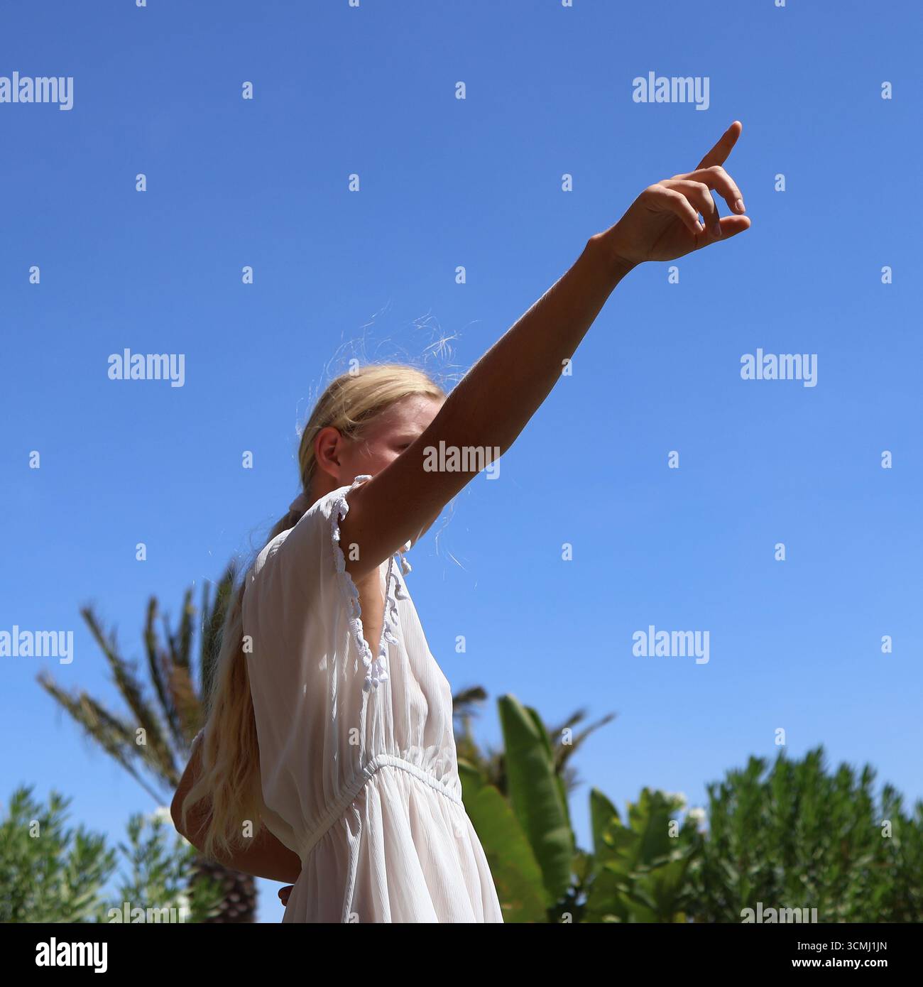 Woman blonde in blue dress hi-res stock photography and images - Alamy