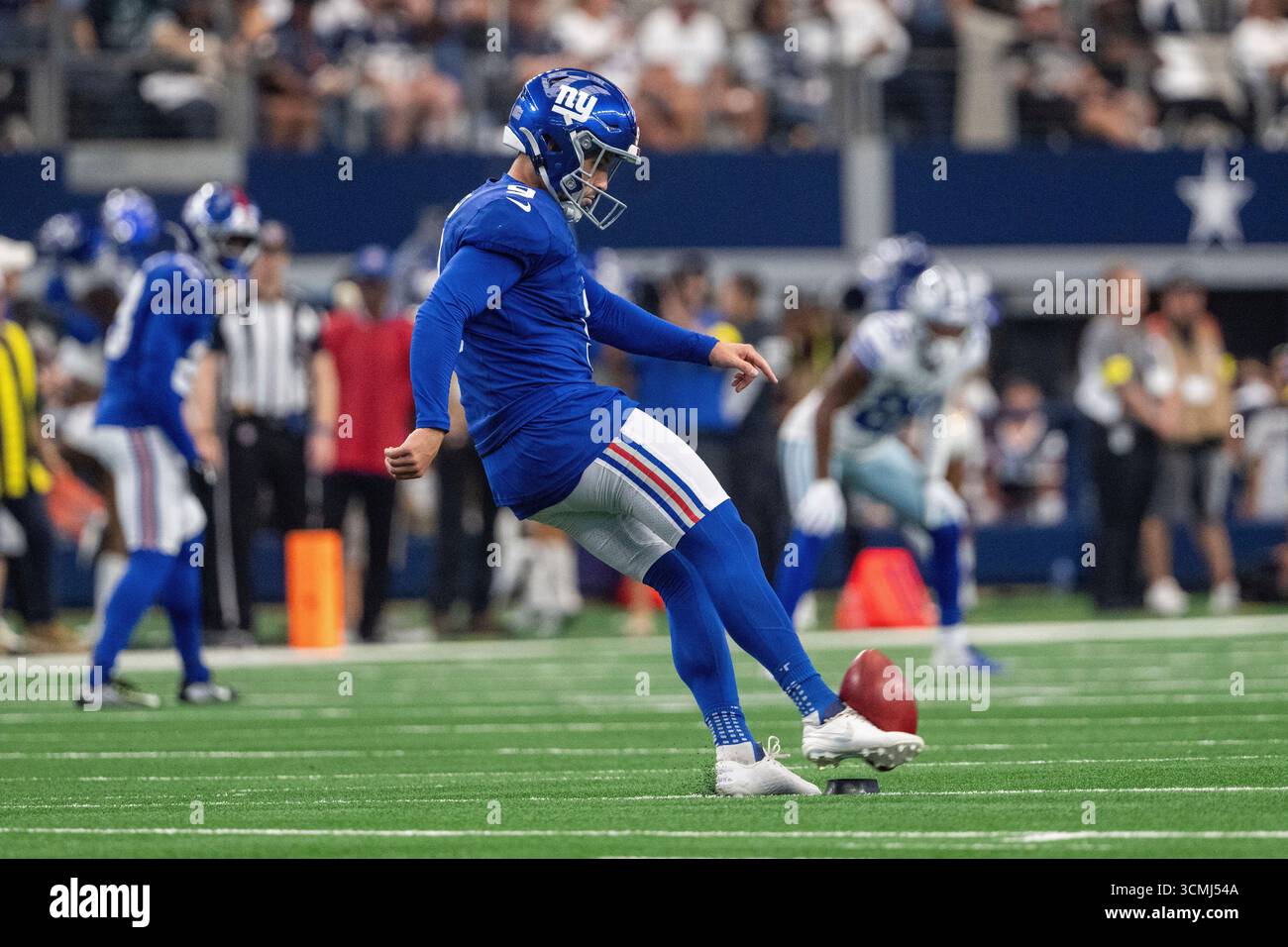 New York Giants kicker Graham Gano kicks off during the first half of a ...