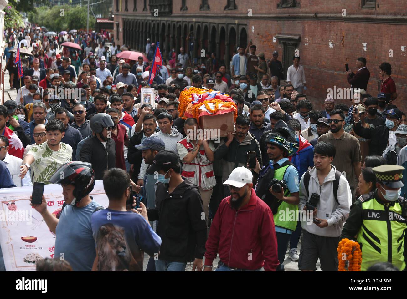 On September 16, 2025, a funeral procession takes place in Kathmandu ...