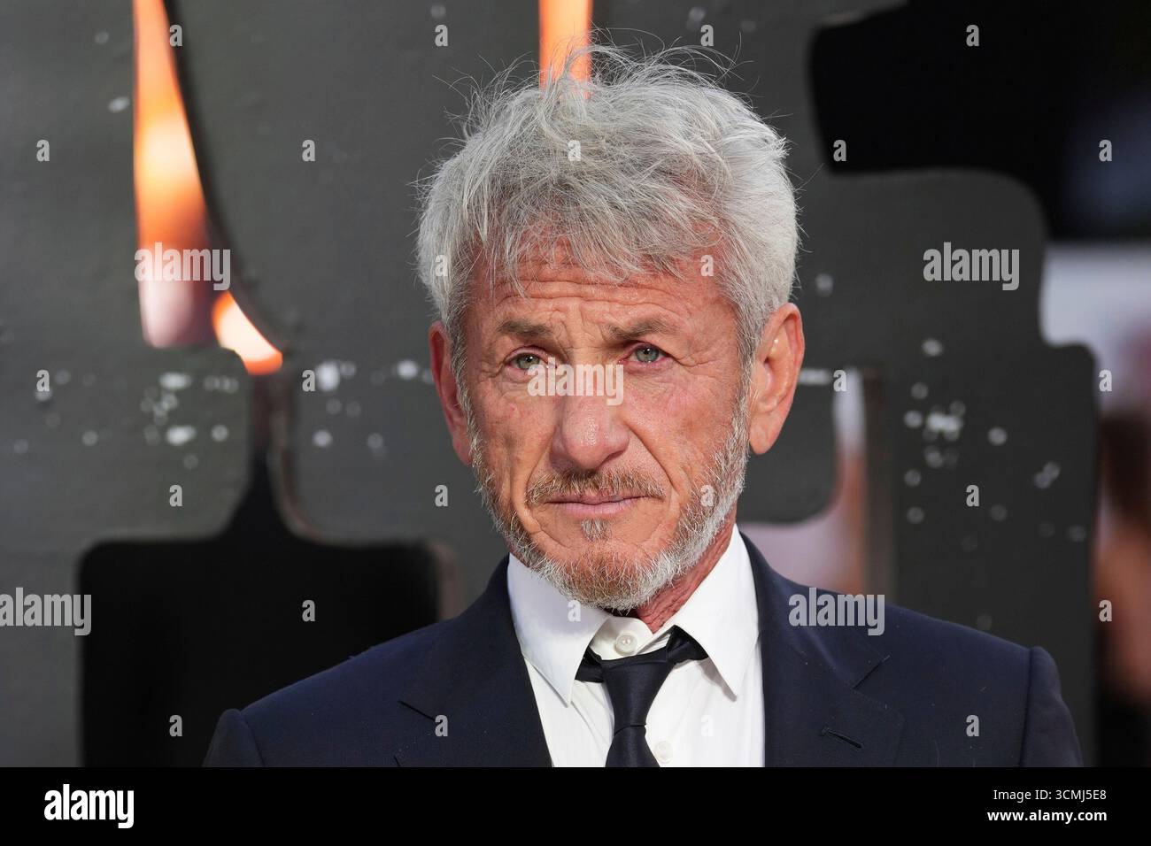 Sean Penn poses for photographers upon arrival at the premiere of the ...