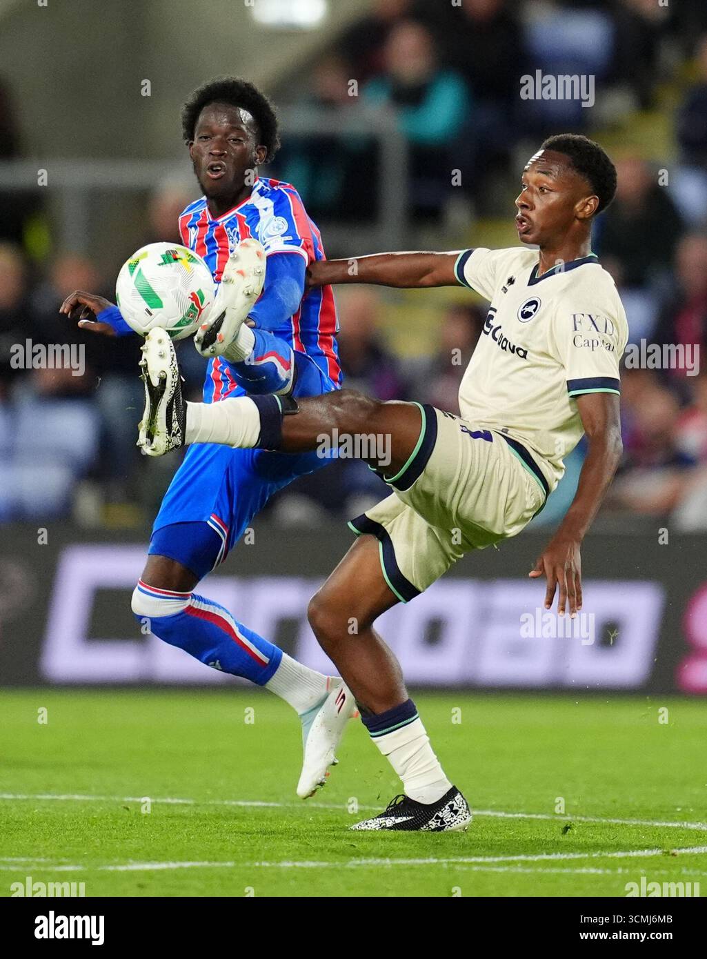 Crystal Palace's Romain Esse (left) and Millwall's Ra'ees Bangura ...