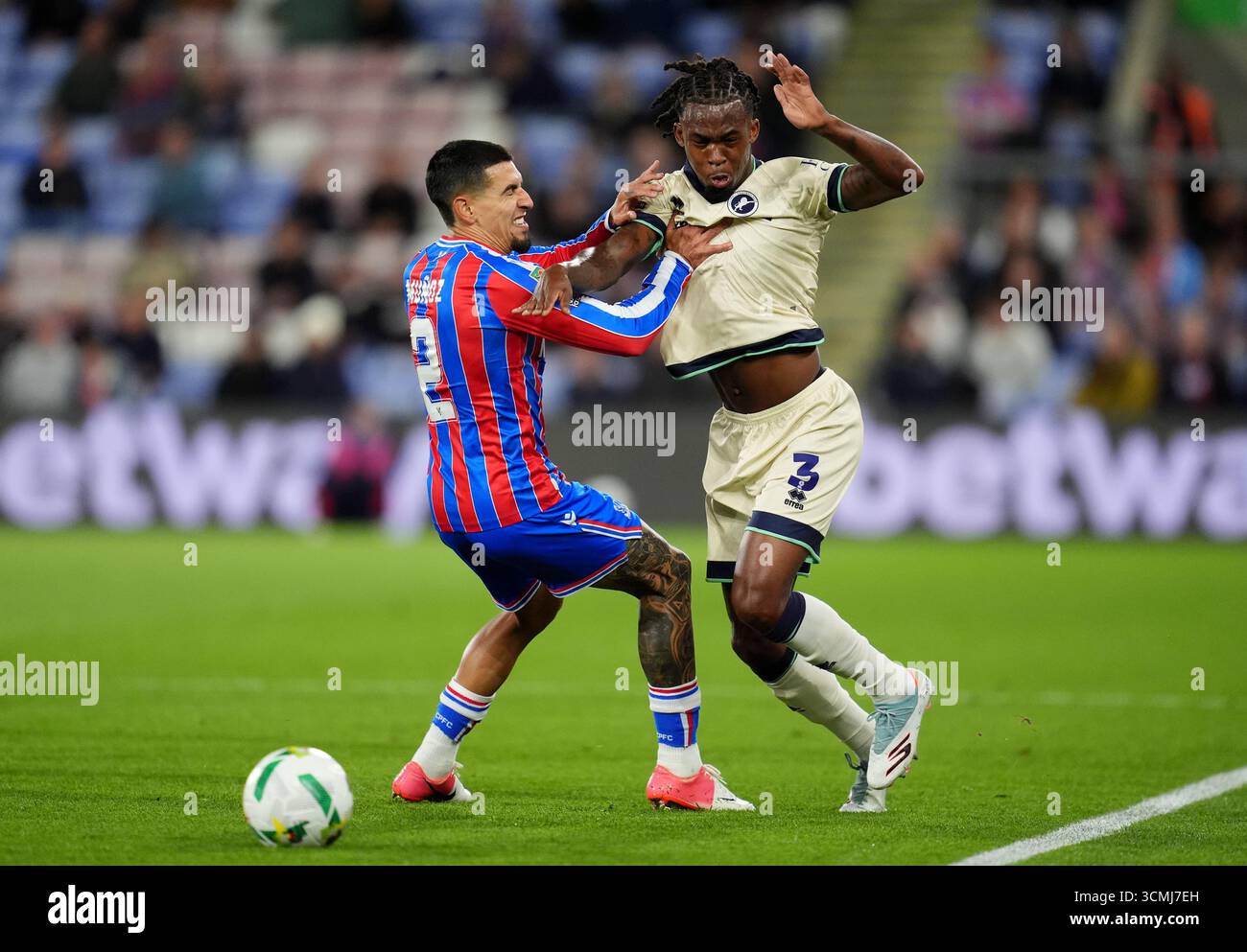 Crystal Palace's Daniel Munoz (left) and Millwall's Zak Sturge battle ...